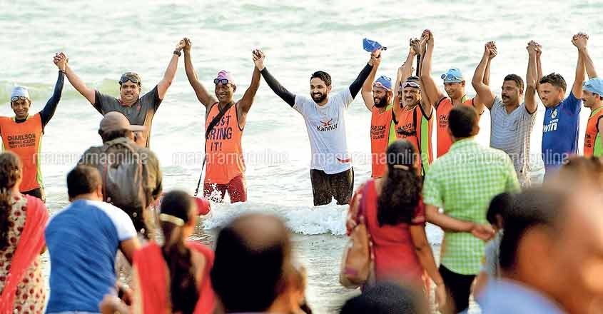 Kannur collector swims 2 kms in sea to raise voter awareness | Kannur News