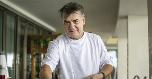 Chef Hermann Grossbichler prepares fresh seafood paella at Bolgatty ...