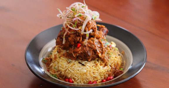 Chicken biwas biryani: An aromatic preparation topped with a herby ...