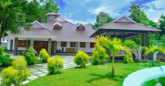 Surrounded by natural greenery, this single-storey Marangattupilly ...