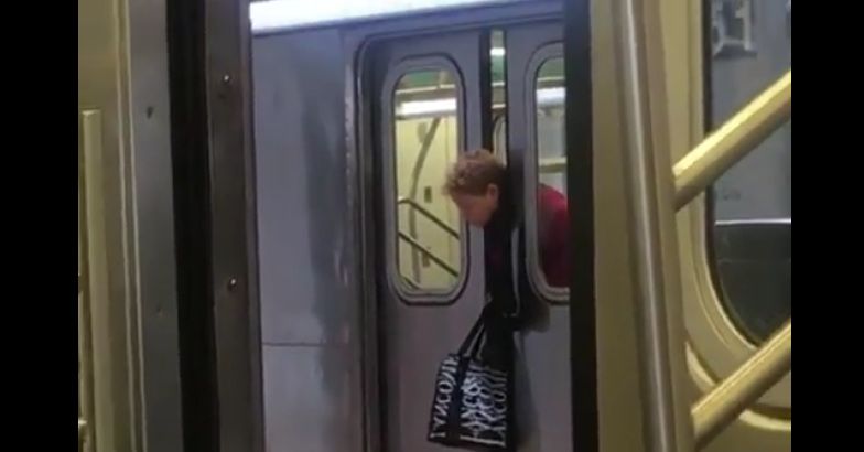 Insensitive world? Video of woman with head stuck between train door ...