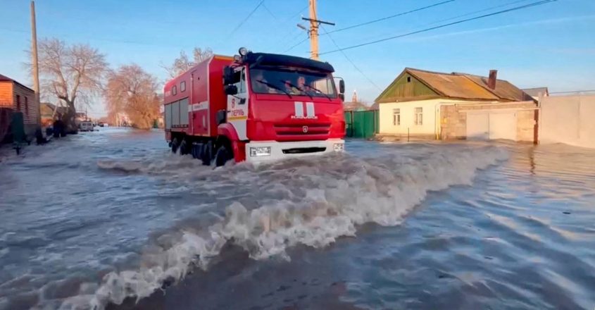 Russia declares emergency after dam burst triggers devastating flood ...